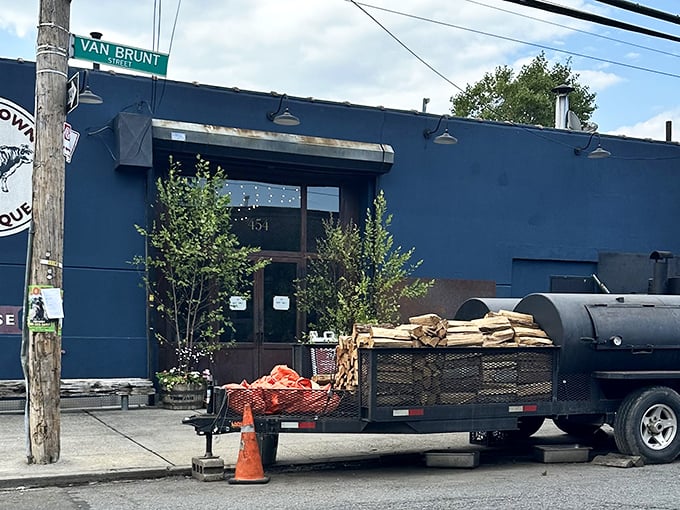 The blue exterior with its vintage cow logo isn't just a restaurant front—it's a beacon of smoke-scented hope for barbecue pilgrims seeking meaty salvation.