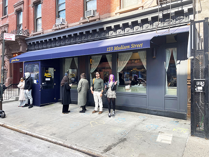 The royal blue awning of Golden Diner stands out like a beacon of breakfast hope on this unassuming Chinatown corner.