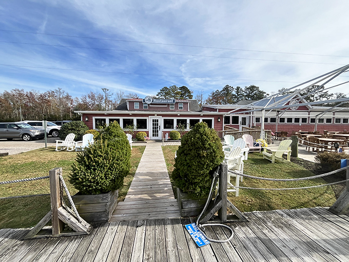 The unassuming pink exterior of Coinjock Marina Restaurant&mdash;proof that culinary treasures often hide in plain sight along North Carolina's waterways.