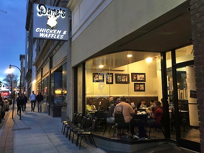 The brick exterior of Dame's Chicken & Waffles stands like a beacon of comfort food in downtown Durham, promising culinary adventures worth every calorie.