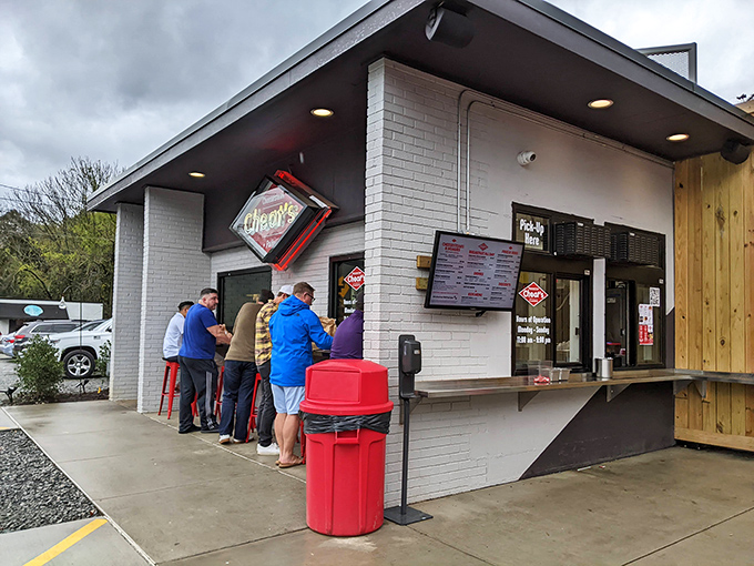 The unassuming white brick exterior of Cheat's Cheesesteaks proves once again that culinary treasures often hide in the simplest packages.