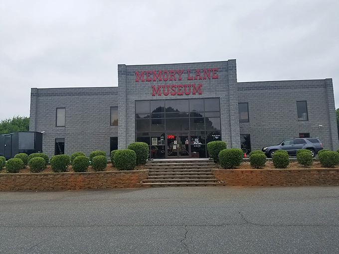 The unassuming exterior of Memory Lane Museum stands like a vault of automotive history, promising treasures that would make any car enthusiast's heart race faster than a NASCAR qualifier.