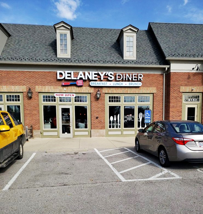 The brick exterior with those eye-catching red doors practically screams "good food inside!" Delaney's Diner stands out without trying too hard.