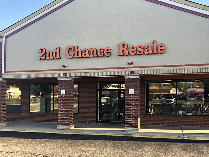 The bright red signage of 2nd Chance Resale beckons like a lighthouse for bargain hunters navigating the sea of retail sameness.