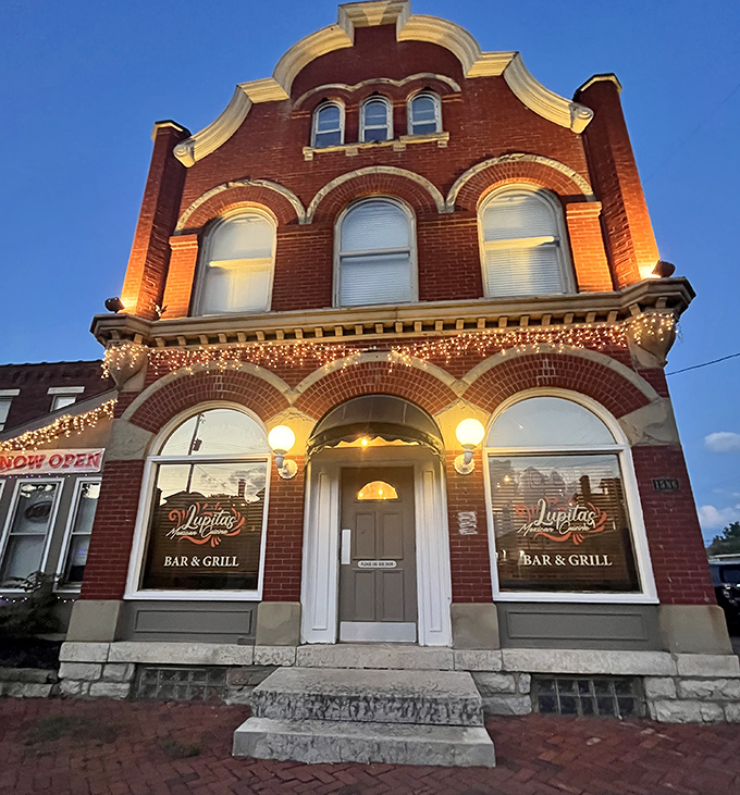 Lupita's historic brick building glows at twilight, like a beacon calling hungry souls home. Those string lights aren't just decoration&mdash;they're a dinner invitation you can't refuse.