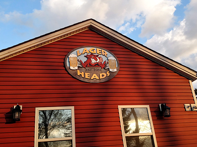 The iconic red exterior of Lager Heads stands like a beacon for BBQ pilgrims, promising smoky delights within those wooden walls.