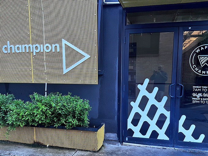 The blue waffle grid beckons like a geometric lighthouse, guiding hungry souls to breakfast nirvana in Oklahoma City.