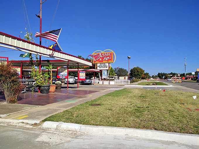 That iconic neon sign isn't just advertising &ndash; it's a time machine promising juicy burgers and nostalgia served in equal portions.
