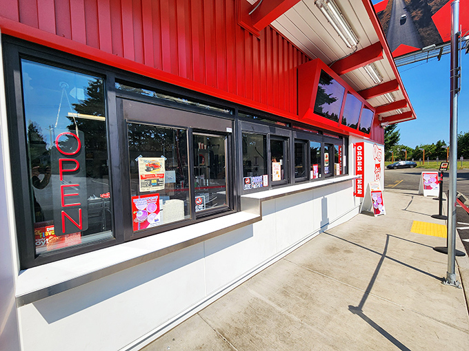 The iconic red exterior of Mike's Drive-In stands as a beacon of burger bliss in Milwaukie, promising nostalgic flavors that never go out of style.