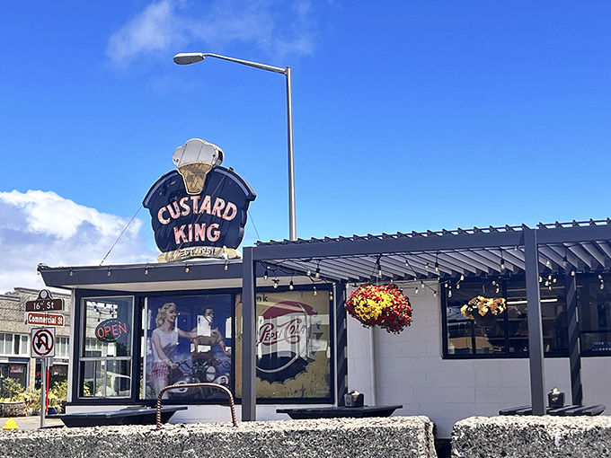The royal blue trim and vintage sign of Custard King stand proudly against Astoria's sky, like a delicious mirage beckoning custard pilgrims.