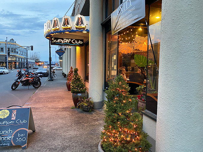 The iconic blue awning with sailboat motifs welcomes you to T. Paul's Supper Club, a coastal gem where Astoria's charm meets culinary excellence. 