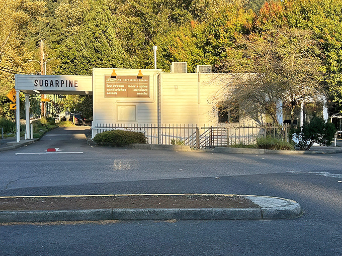 Sugarpine Drive-In's classic white exterior beckons like a mirage in the Oregon wilderness. Nostalgia with a modern twist awaits. 