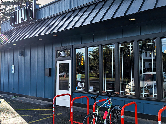 The blue-trimmed storefront with its glowing "OPEN" sign isn't just inviting&mdash;it's practically whispering sweet caffeinated promises to passersby.