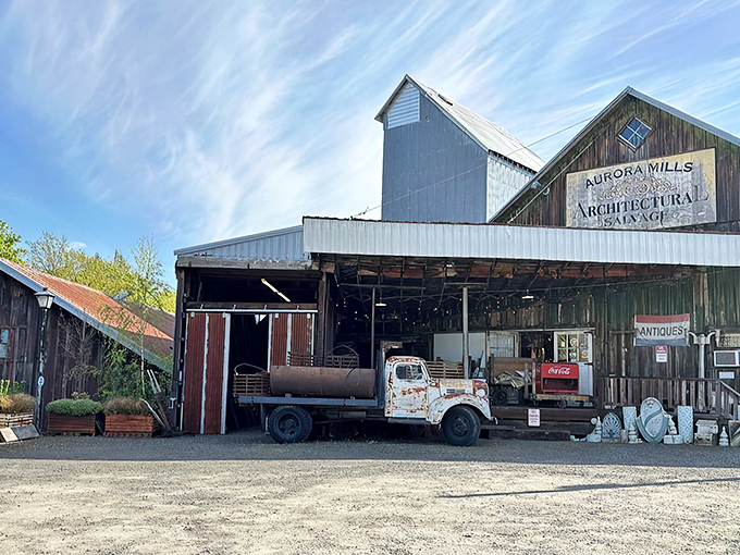 The weathered barn exterior of Aurora Mills isn't just a building&mdash;it's a time machine disguised as Oregon's ultimate treasure chest.