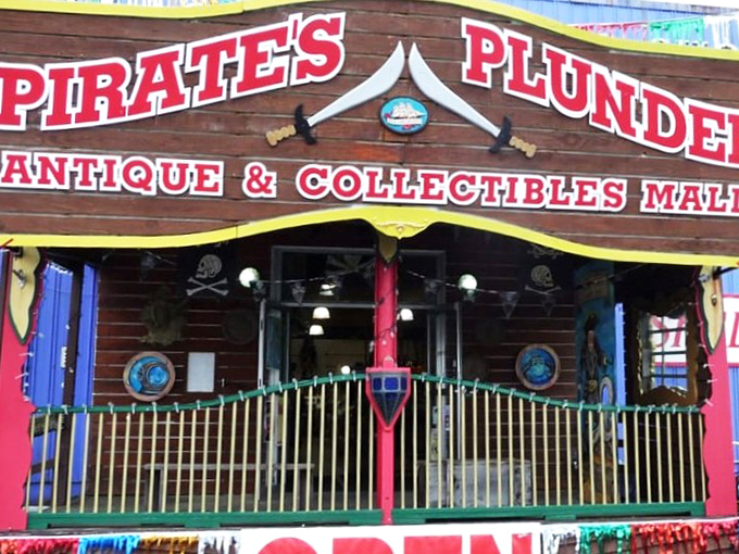 The exterior screams "adventure awaits!" with its wooden ship-styled sign and bright red building. Newport's most colorful treasure hunt begins here. 