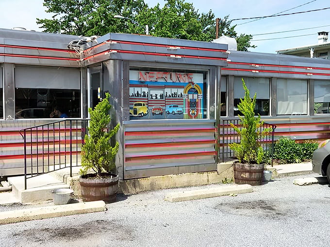 Neptune Diner's gleaming stainless steel exterior with classic red trim isn't just nostalgic&mdash;it's a time machine disguised as a restaurant. Comfort awaits inside. 