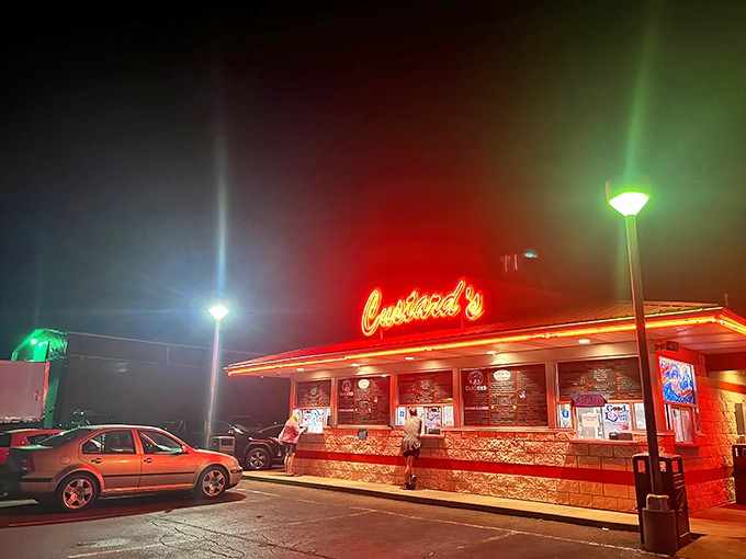 The neon glow of Custard's against a twilight sky isn't just signage&mdash;it's a beacon of hope for dessert lovers seeking frozen nirvana.