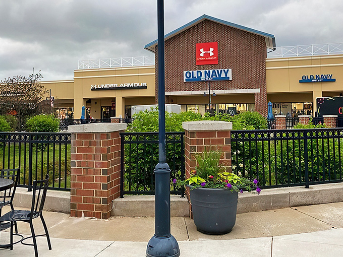 The brick facade of Philadelphia Premium Outlets welcomes bargain hunters like an old friend promising treasures within. LOFT beckons from just beyond the entrance.