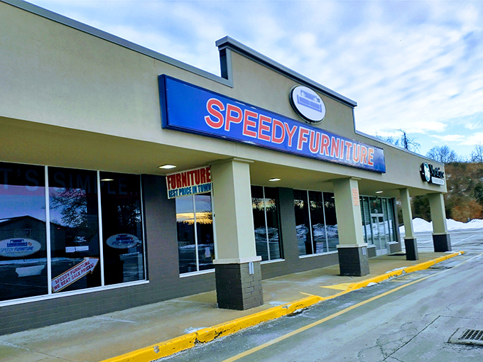 The blue and red storefront beckons like a furniture oasis in the strip mall desert. No pretension, just promises of comfortable living ahead.