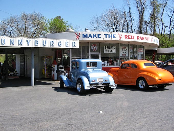 The iconic "Make The Red Rabbit A Habit" sign welcomes hungry travelers like a beacon of burger salvation on Route 322. Nostalgia never tasted so good.