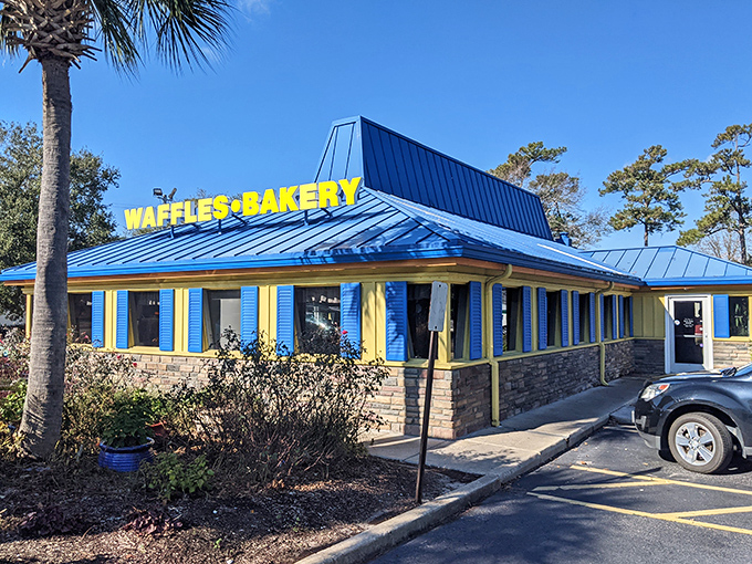 The bright blue roof and cheerful yellow walls of Johnny D's beckon like a breakfast lighthouse, promising delicious refuge from ordinary morning meals.