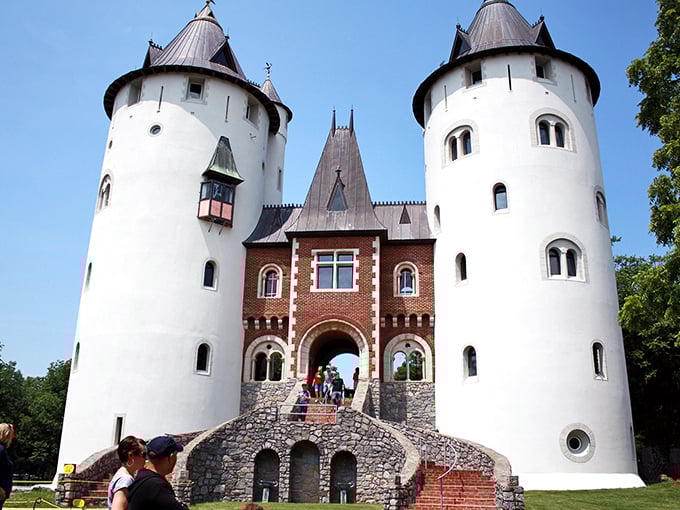 The majestic exterior of Castle Gwynn stands proudly against the Tennessee sky, its white towers a startling medieval vision in the Southern landscape.