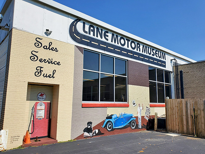 The unassuming exterior of Lane Motor Museum, where automotive dreams hide behind a vintage bakery facade. Who knew bread and bizarre vehicles had so much in common?