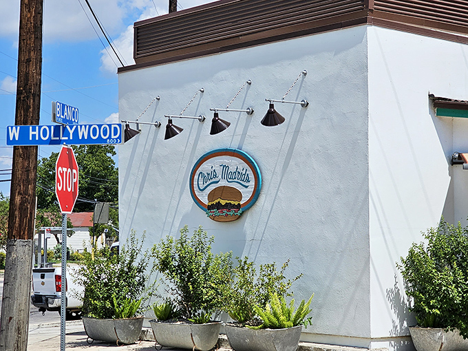 The corner of Blanco and Hollywood marks the spot where burger dreams come true at Chris Madrid's iconic white building.