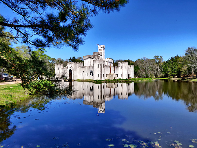 A medieval mirage rising from the Texas countryside, complete with moat and lily pads. Camelot meets cattle country in spectacular fashion.