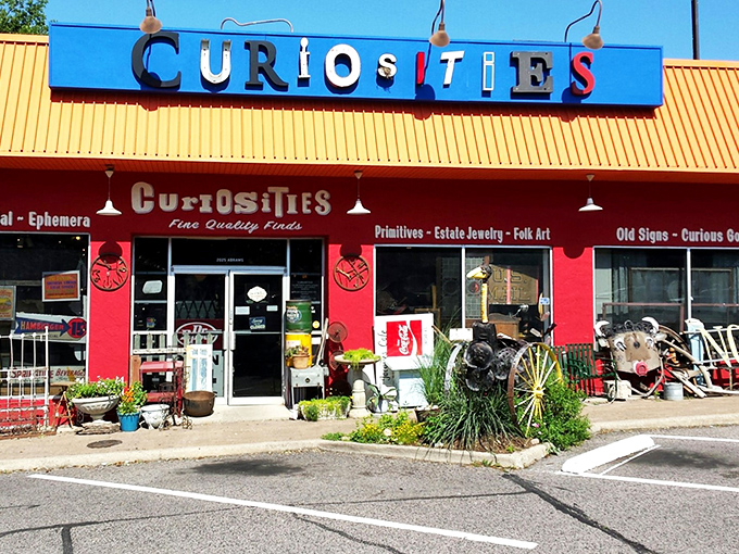 The vibrant red exterior of Curiosities stands out like a beacon of eccentricity, promising treasures that would make any collector's heart skip a beat.