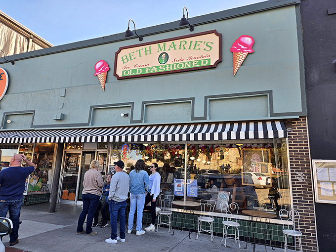 The mint-green facade with those iconic ice cream cone signs is like a beacon of sweetness on Denton's historic square.