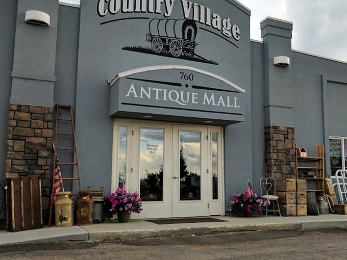 The unassuming exterior of Country Village Antique Mall belies the wonderland within, like a time-travel portal disguised as a suburban building.