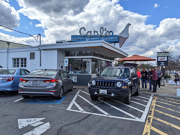 The iconic Art Deco fa&ccedil;ade of Carl's stands like a beacon of frozen delight against the Virginia sky. Some buildings just scream "summer memories inside!"