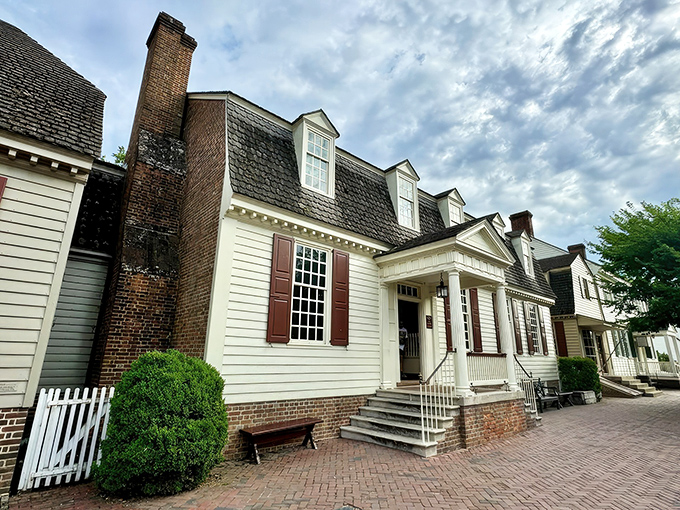 Colonial charm meets twilight magic at King's Arms Tavern, where the glowing windows promise warmth and "GOOD EATING" after a day of historical wanderings.