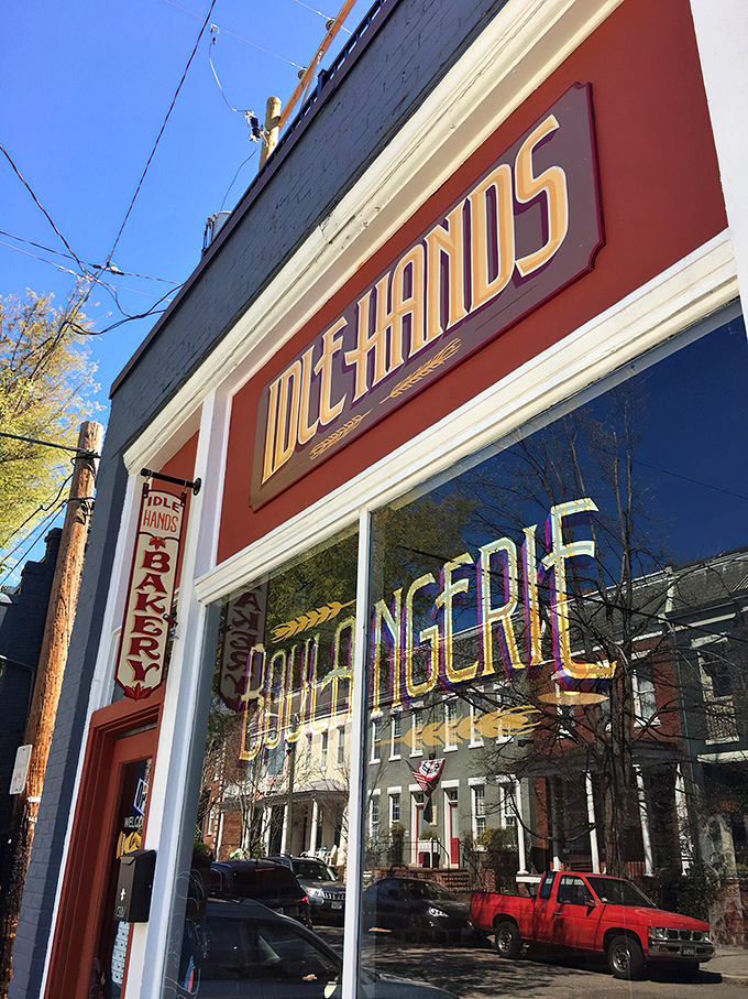 The iconic red storefront of Idle Hands beckons carb enthusiasts like a lighthouse guiding hungry ships to buttery shores.