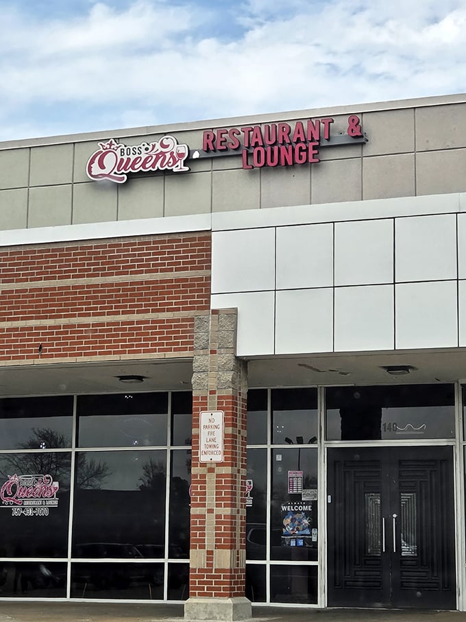 The modern brick-and-glass exterior of Boss Queens might look unassuming, but inside awaits a soul food revelation worth crossing state lines for.