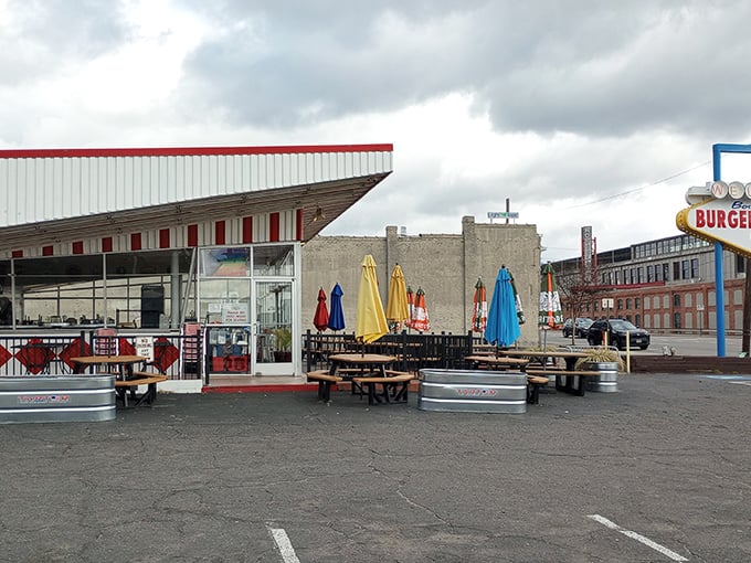 The retro-futuristic design of Boulevard Burger & Brew beckons like a time machine disguised as a diner. Those colorful umbrellas aren't just for show&mdash;they're happiness markers.