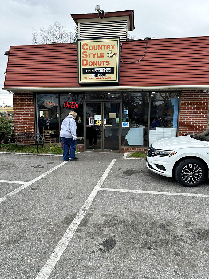 The red siding and vintage sign promise a time-traveling donut experience. Some buildings just whisper "delicious things happen here," and this one shouts it.