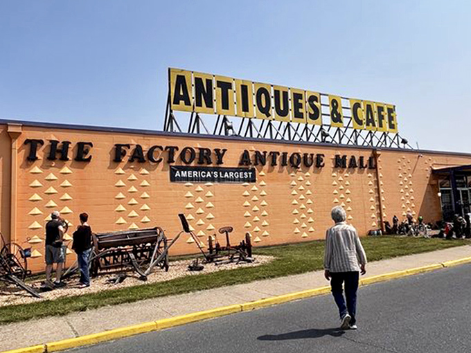 The unmistakable bright orange exterior announces itself like a vintage billboard come to life. America's largest antique mall isn't shy about its superlative status!