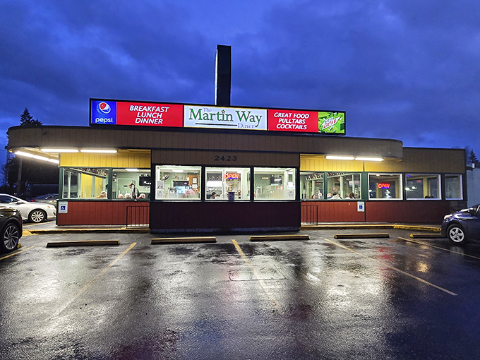 The sunshine-yellow exterior of Martin Way Diner stands out like a beacon of hope for hungry travelers. No fancy architecture needed when what's inside matters most.