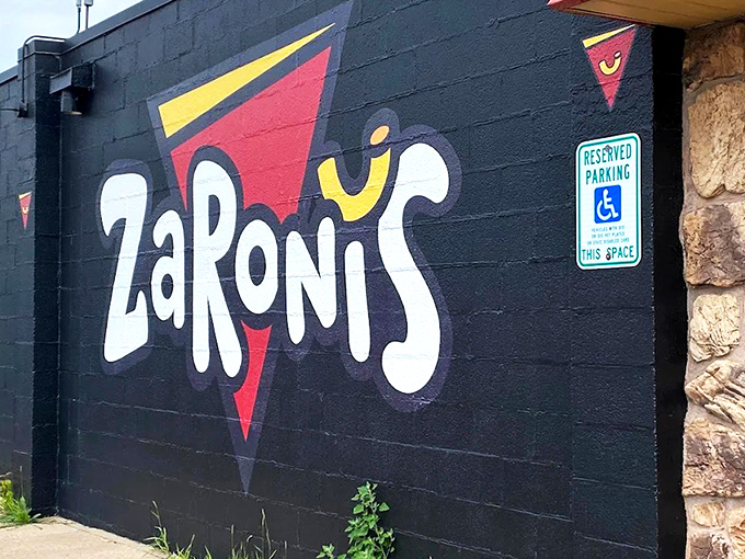 The bold, playful logo on ZaRoni's exterior wall is like a bat signal for the pizza-obsessed. Come for the quirky name, stay for the culinary adventure. 