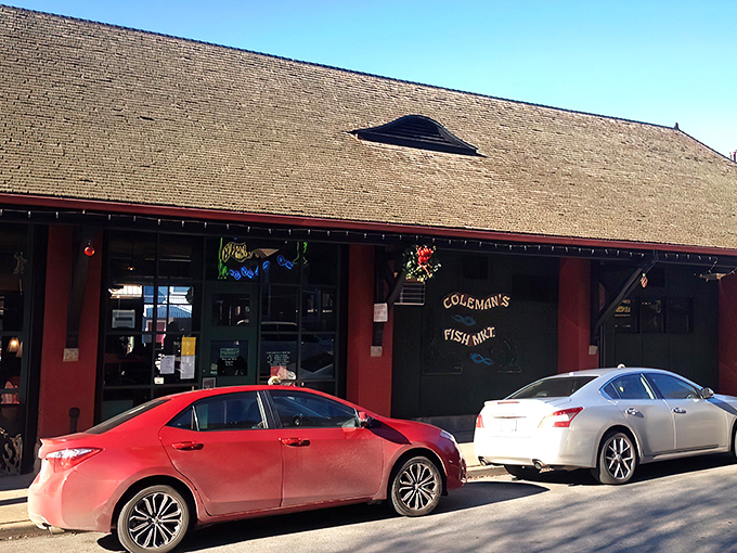 The neon fish sign glows like a beacon of hope for hungry souls. Coleman's exterior promises seafood salvation in the heart of Wheeling.