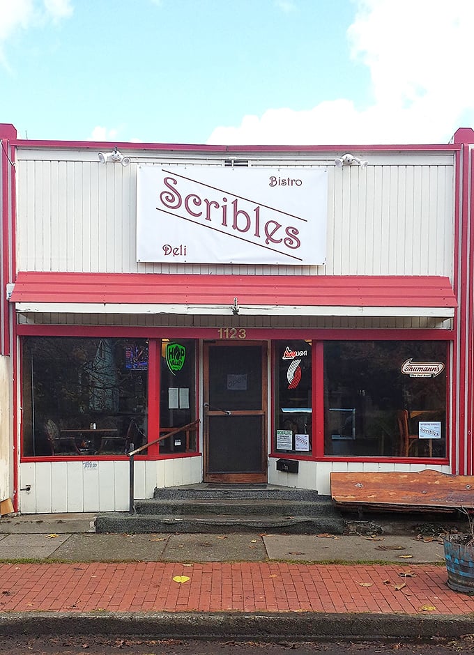 Welcome to sandwich paradise! Scribles Bistro & Deli's charming exterior promises a feast for the senses, with its inviting red trim and vintage-style sign.