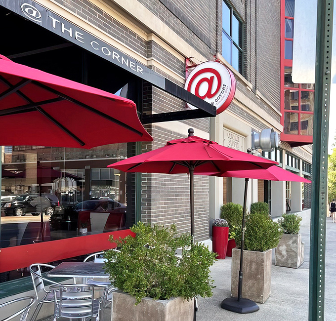 The iconic red and white circular sign beckons hungry travelers to this brick corner building, promising comfort food with urban style.