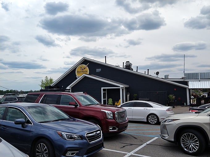 The blue-gray exterior of Boathouse Kitchen & Swan Dive stands ready to welcome hungry visitors, a lakeside beacon for flavor-seekers on Morse Reservoir.