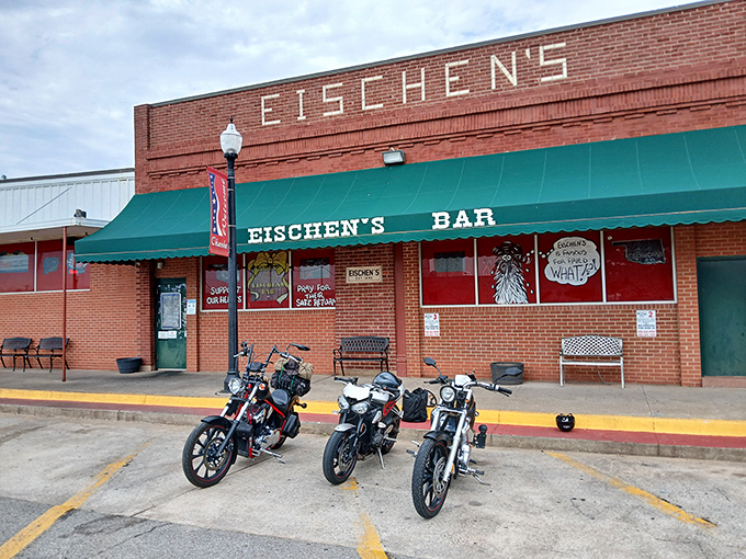 The unassuming exterior of Eischen's Bar hides Oklahoma's worst-kept culinary secret. Packed parking lot tells the real story—people know where the good stuff is.