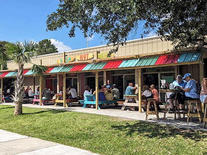 Fish Hut Grill&rsquo;s laid-back vibe is pure coastal bliss&mdash;picnic tables, fresh catch, and sunny smiles all around.