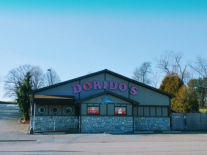 The glowing red Dorido's sign against rustic wood paneling promises seafood salvation in Pittsburgh's concrete jungle. Maritime magic awaits!