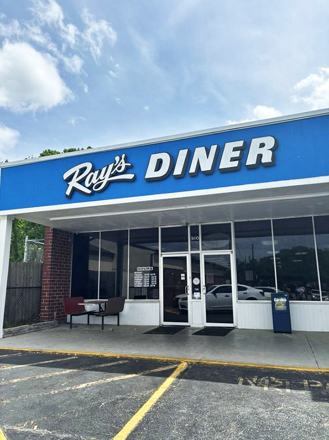 The iconic blue sign of Ray's Diner stands as a beacon of breakfast hope on Two Notch Road in Columbia.