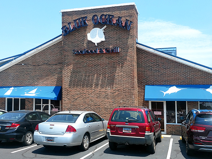 The distinctive blue roof and octagonal tower of Blue Ocean Seafood Restaurant stand as a beacon for hungry travelers seeking seafood salvation in Clinton.